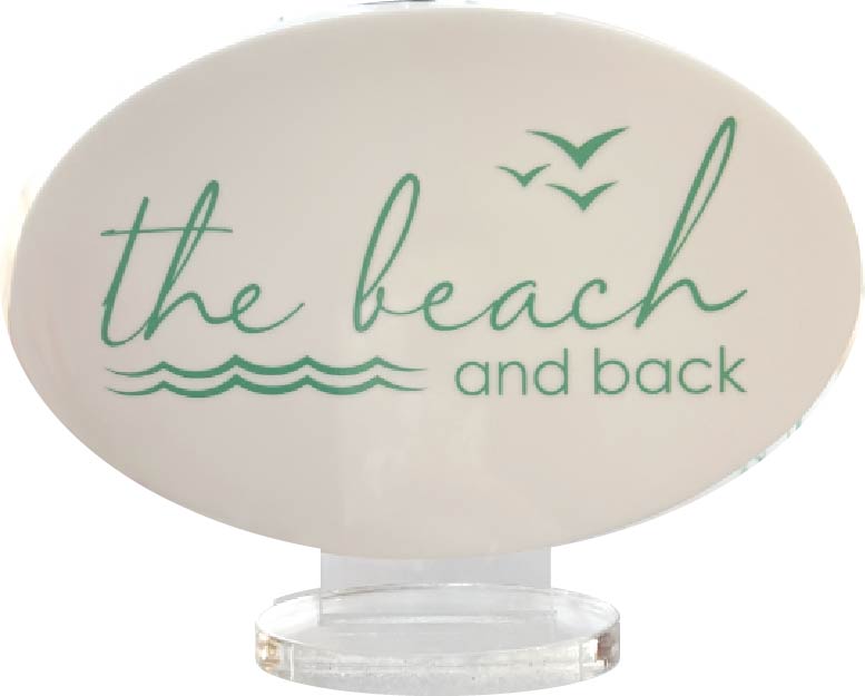 the beach and back table top sign